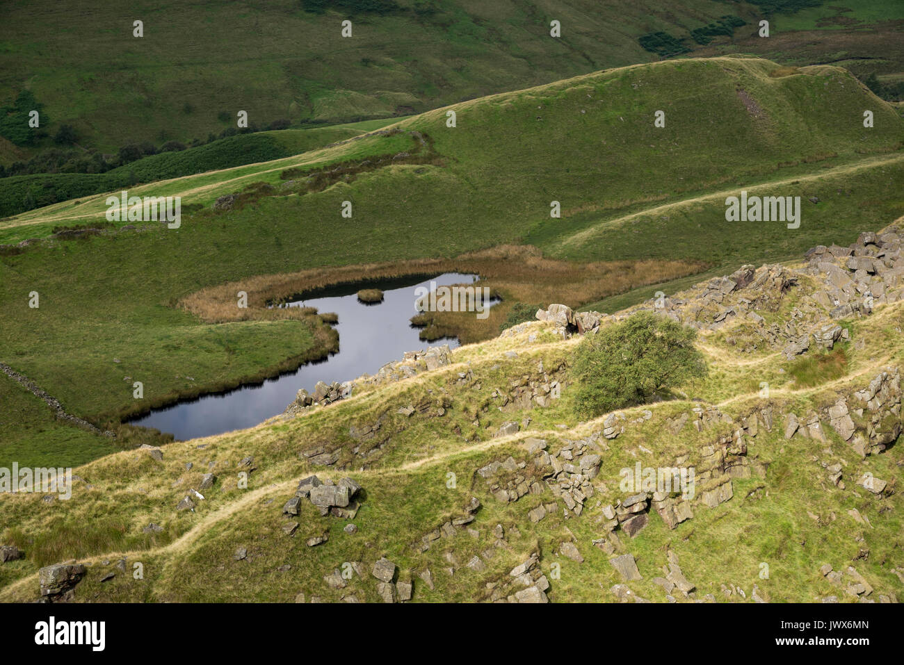 Lake below Alport Castles, A dramatic natural feature in the Alport ...
