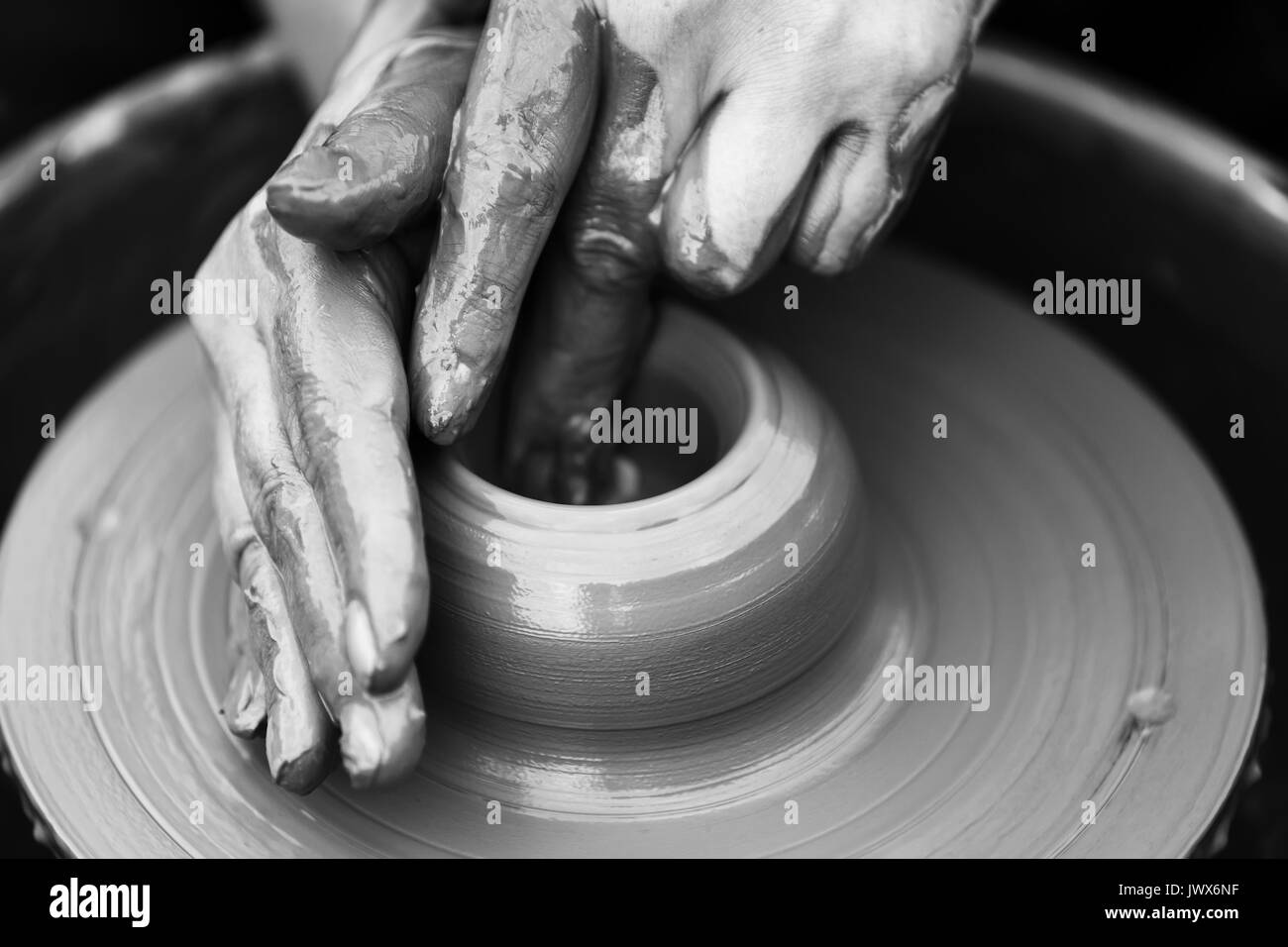 Hands of a potter. Potter making ceramic pot on the pottery wheel Stock ...