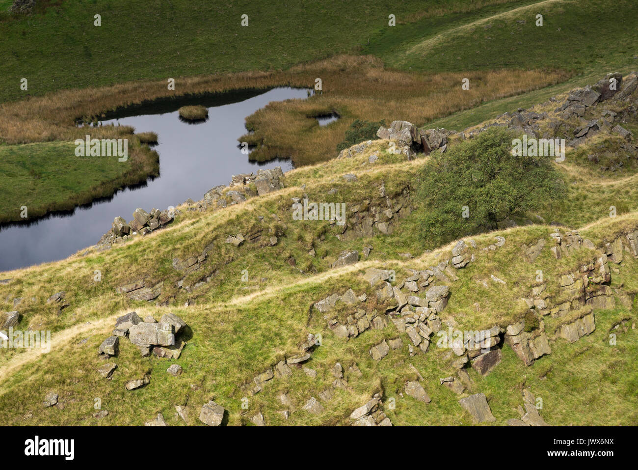 Lake below Alport Castles, A dramatic natural feature in the Alport ...