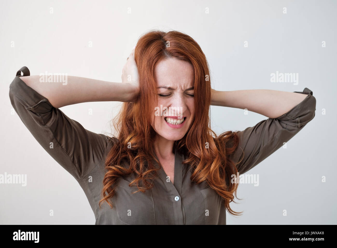 Woman covering ears noise hi-res stock photography and images - Alamy