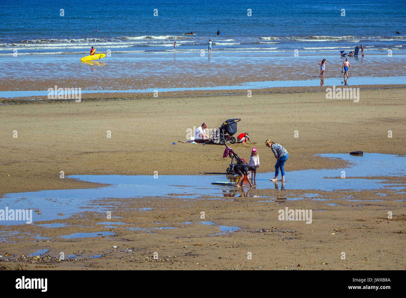 Summer holiday crowds on the beach, Saltburn by the Sea, North ...
