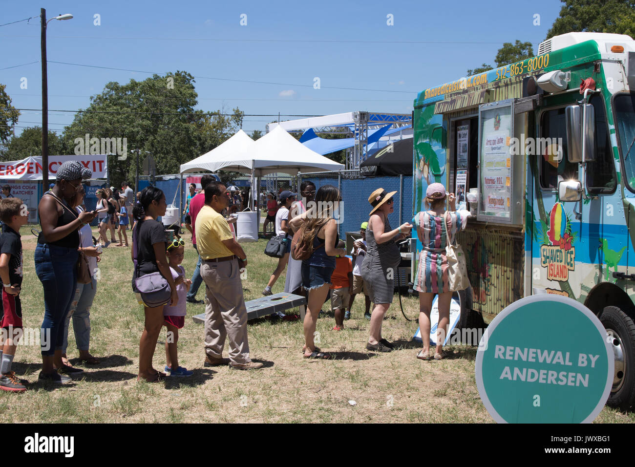 Crowd scene of Austin Ice Cream Festival. Line of multiracial people at ...