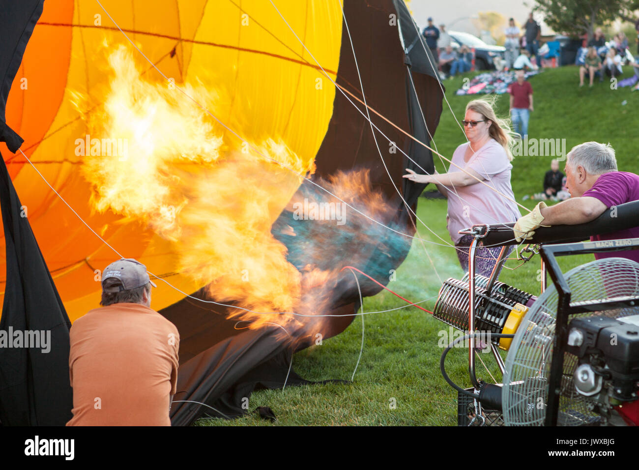 The flame blasting into a hot air balloon, heating it up before ...