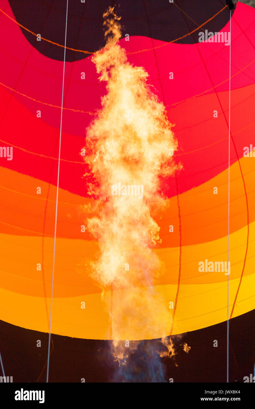 The flame blasting into a hot air balloon, heating it up before ...