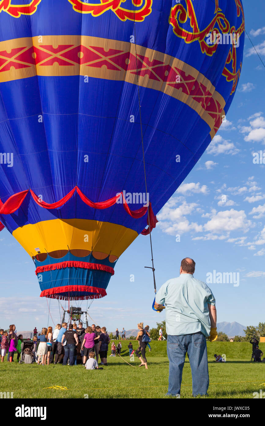 The flame blasting into a hot air balloon, heating it up before ...