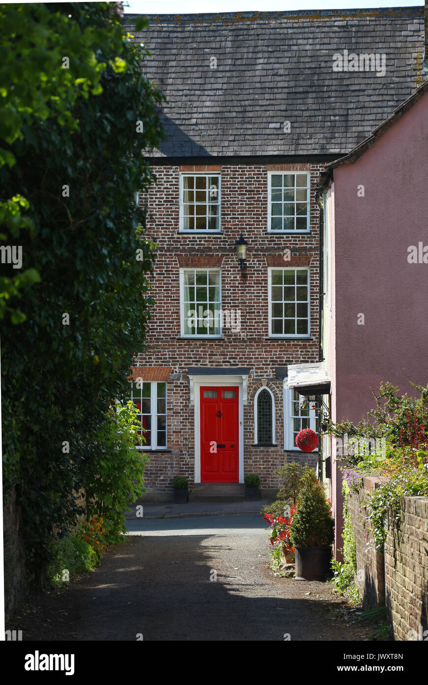 Old three story brick house on the High Street near Berkeley Castle ...
