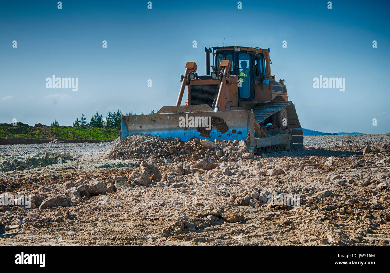 bulldozer a moving land shovel Stock Photo - Alamy