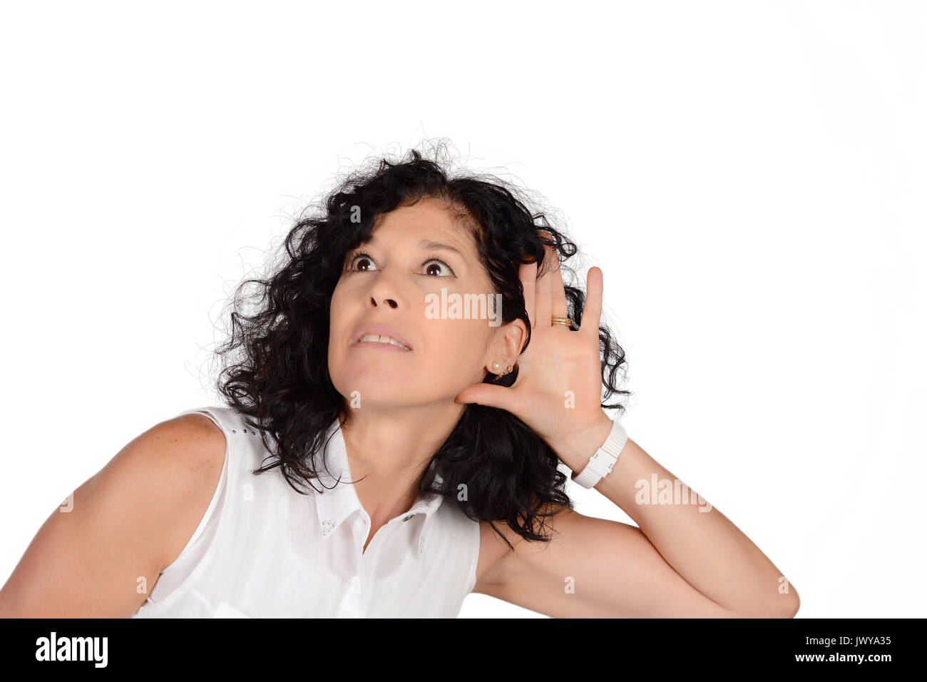 Portrait of beautiful woman hearing something. Isolated white ...