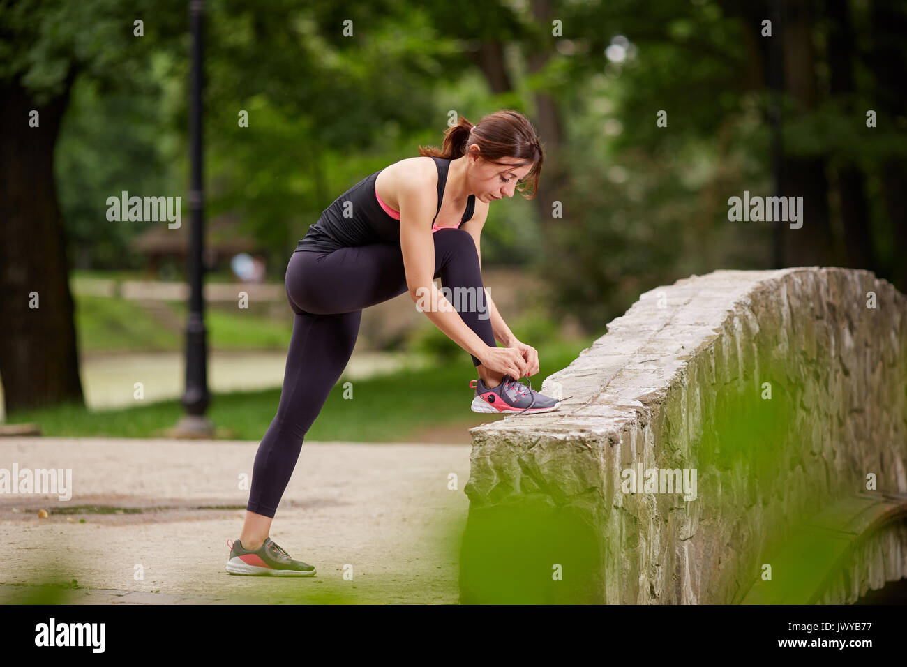 Sportive woman preparing for workout Stock Photo - Alamy