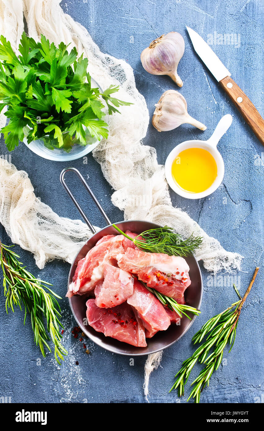 raw meat with oil and spice on a table Stock Photo - Alamy