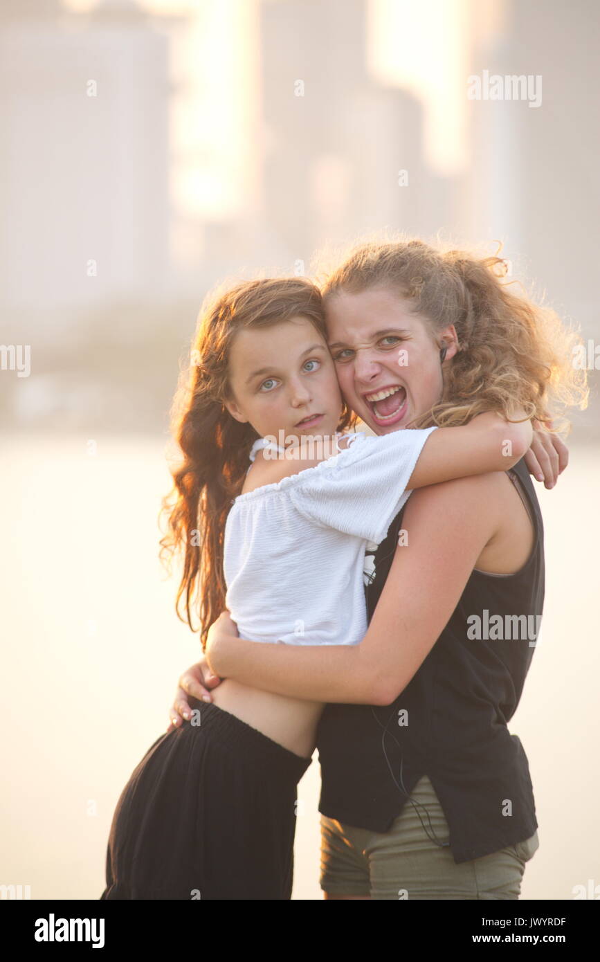 Two sisters hugging hi-res stock photography and images - Alamy