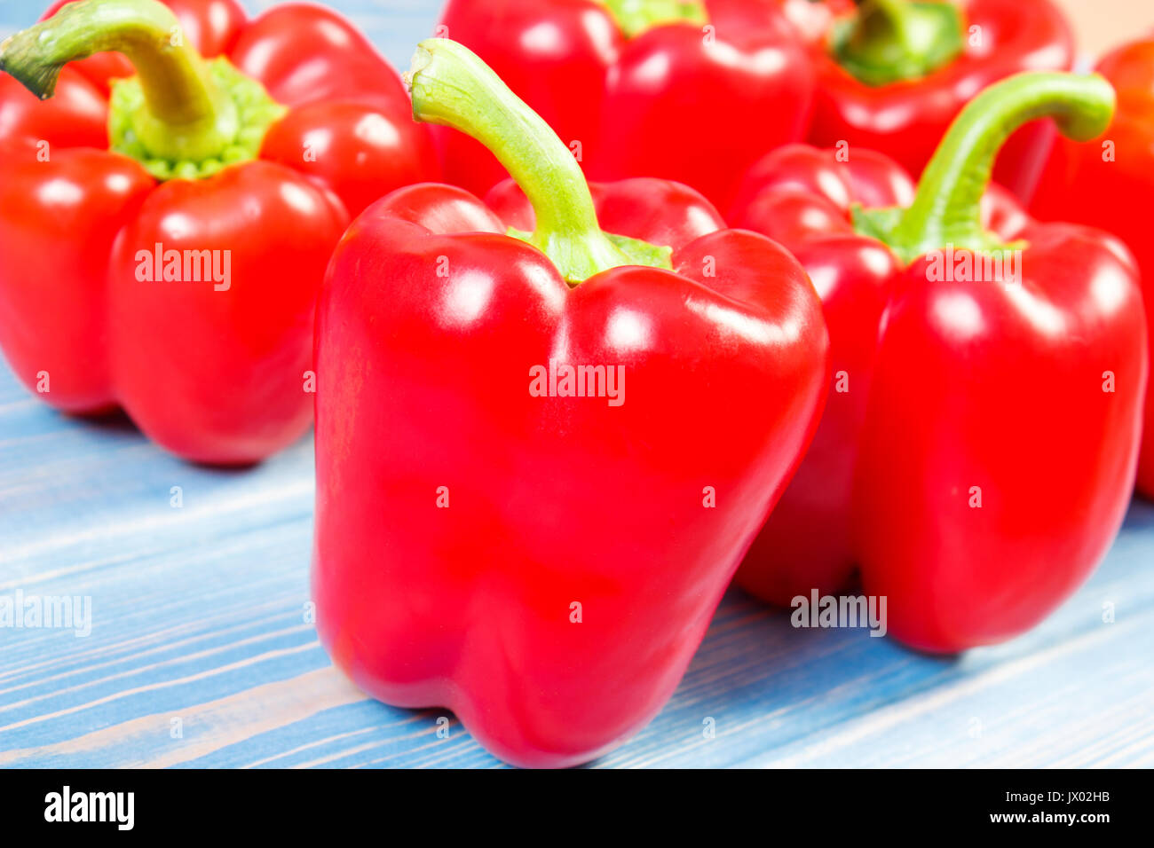 Red peppers lying on blue boards, concept of healthy nutrition Stock ...