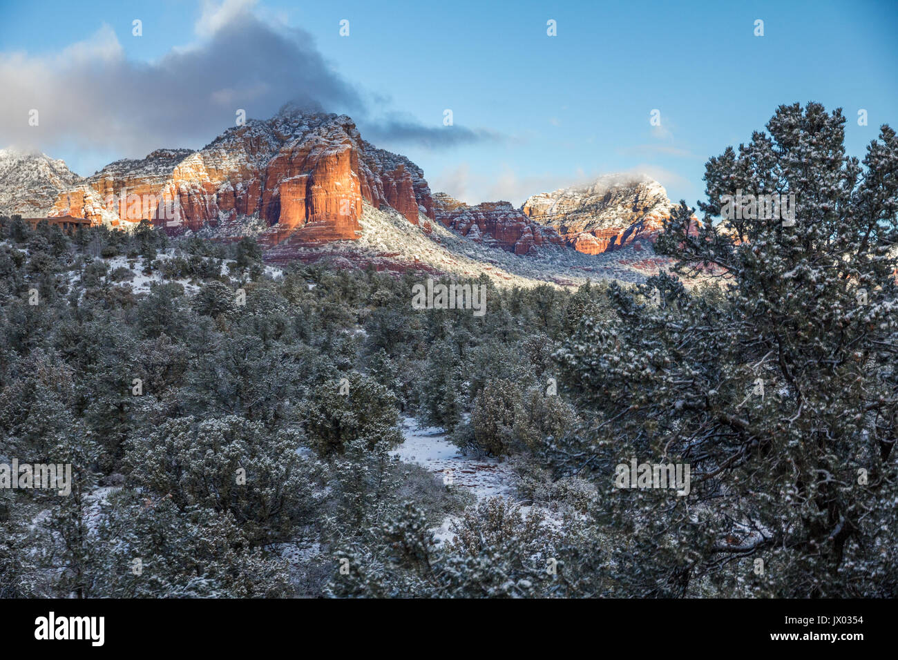 Thunder Mountain illuminated by the first warm sunrays of dawn after an ...