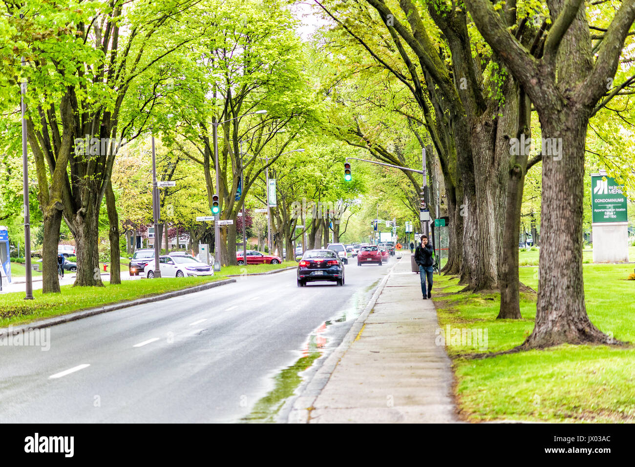 Quebec City, Canada - May 30, 2017: Man walking on sidewalk in morning ...