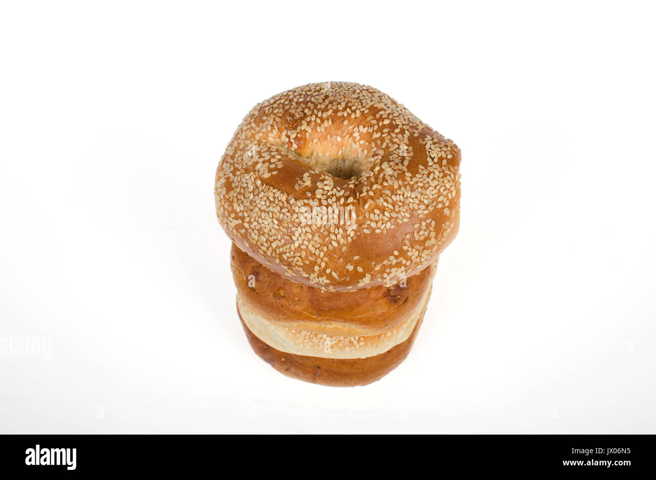 Stack of bagels with Sesame seed bagel on top on white background ...