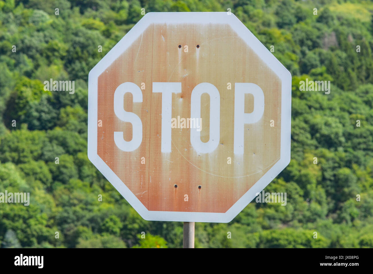Faded red stop sign hi-res stock photography and images - Alamy