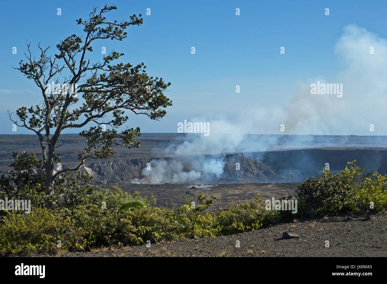 Red hot lava, steam, smoke and fire from the Kilauea volcano at the rim ...