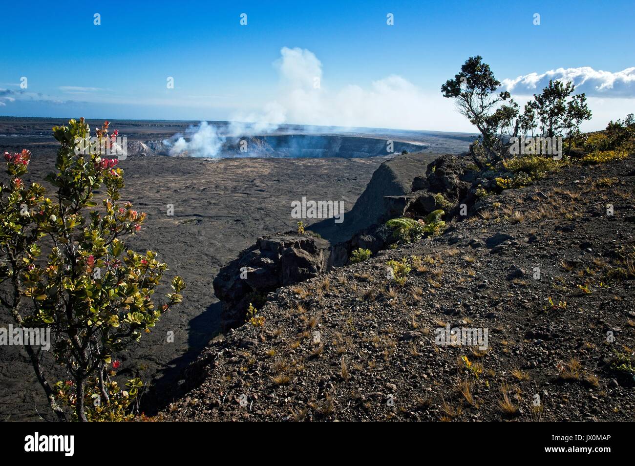 Red hot lava, steam, smoke and fire from the Kilauea volcano at the rim ...