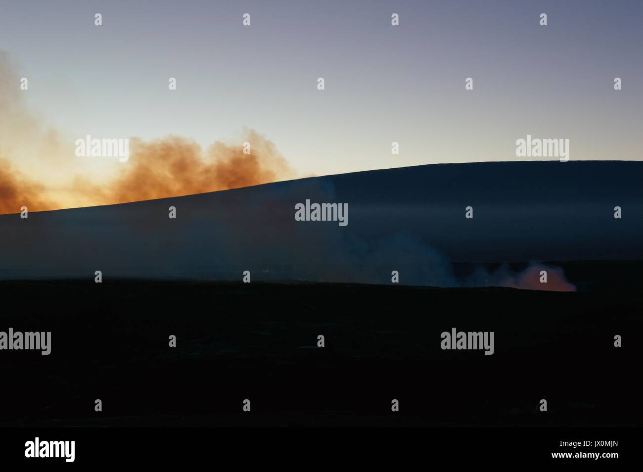 Red hot lava, steam, smoke and fire from the Kilauea volcano at the rim ...
