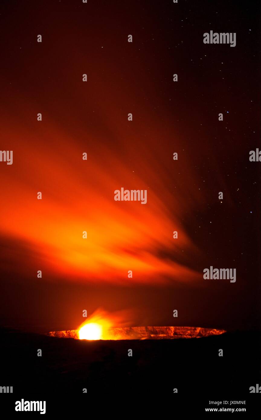 Red hot lava, steam, smoke and fire from the Kilauea volcano at the rim ...