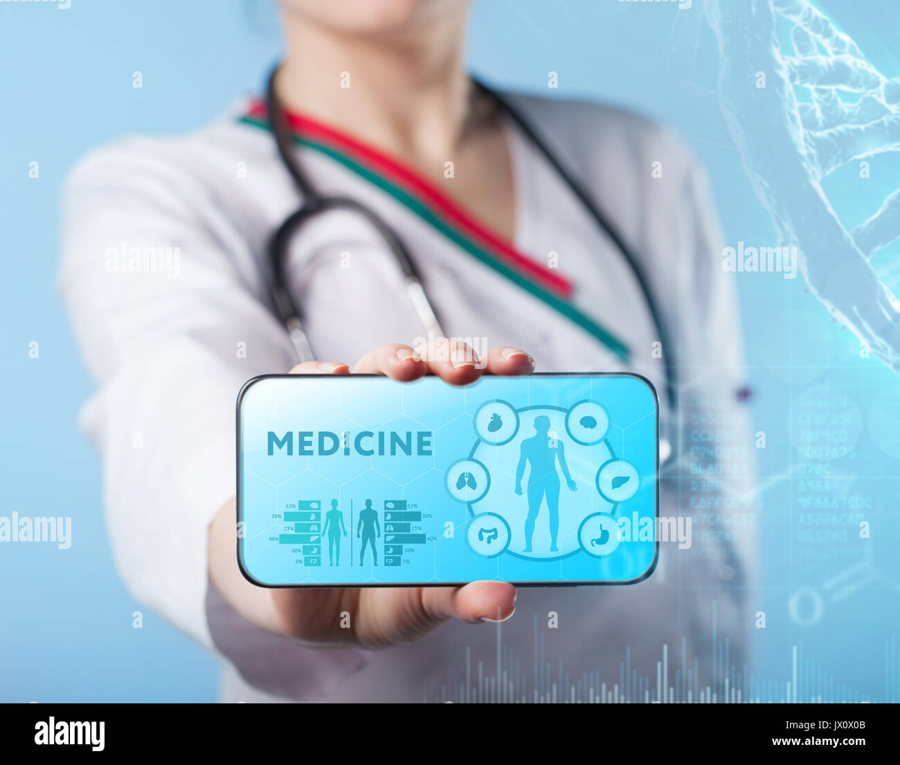Female medicine doctor holding mobile phone and showing it to camera ...
