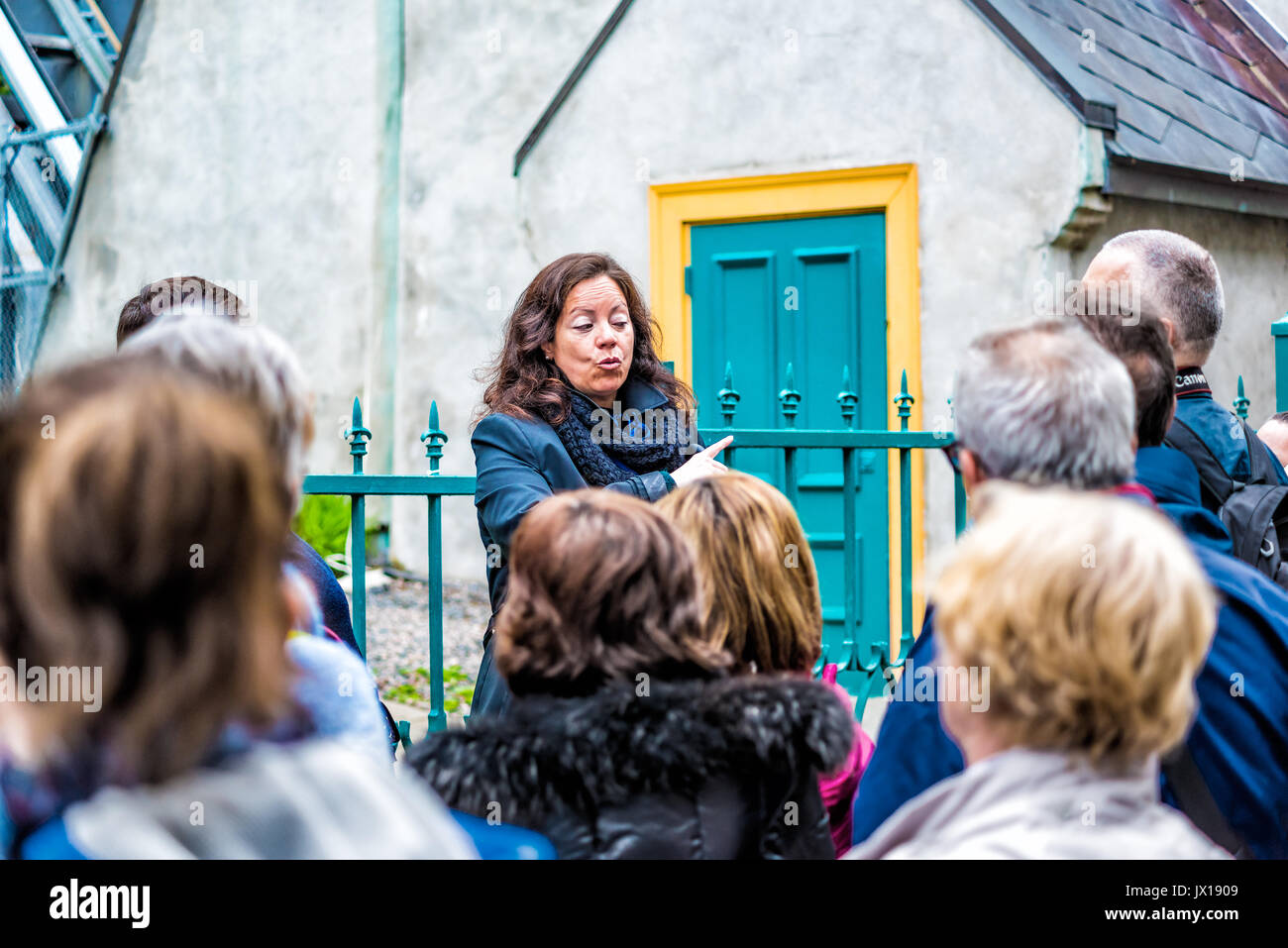 Tour group guide speaking explaining hi-res stock photography and ...