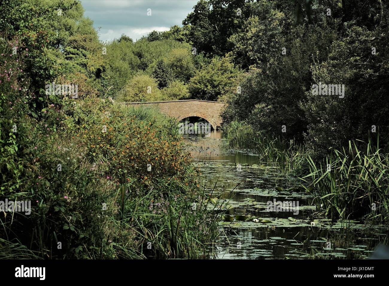 red brick bridge over river Stock Photo - Alamy