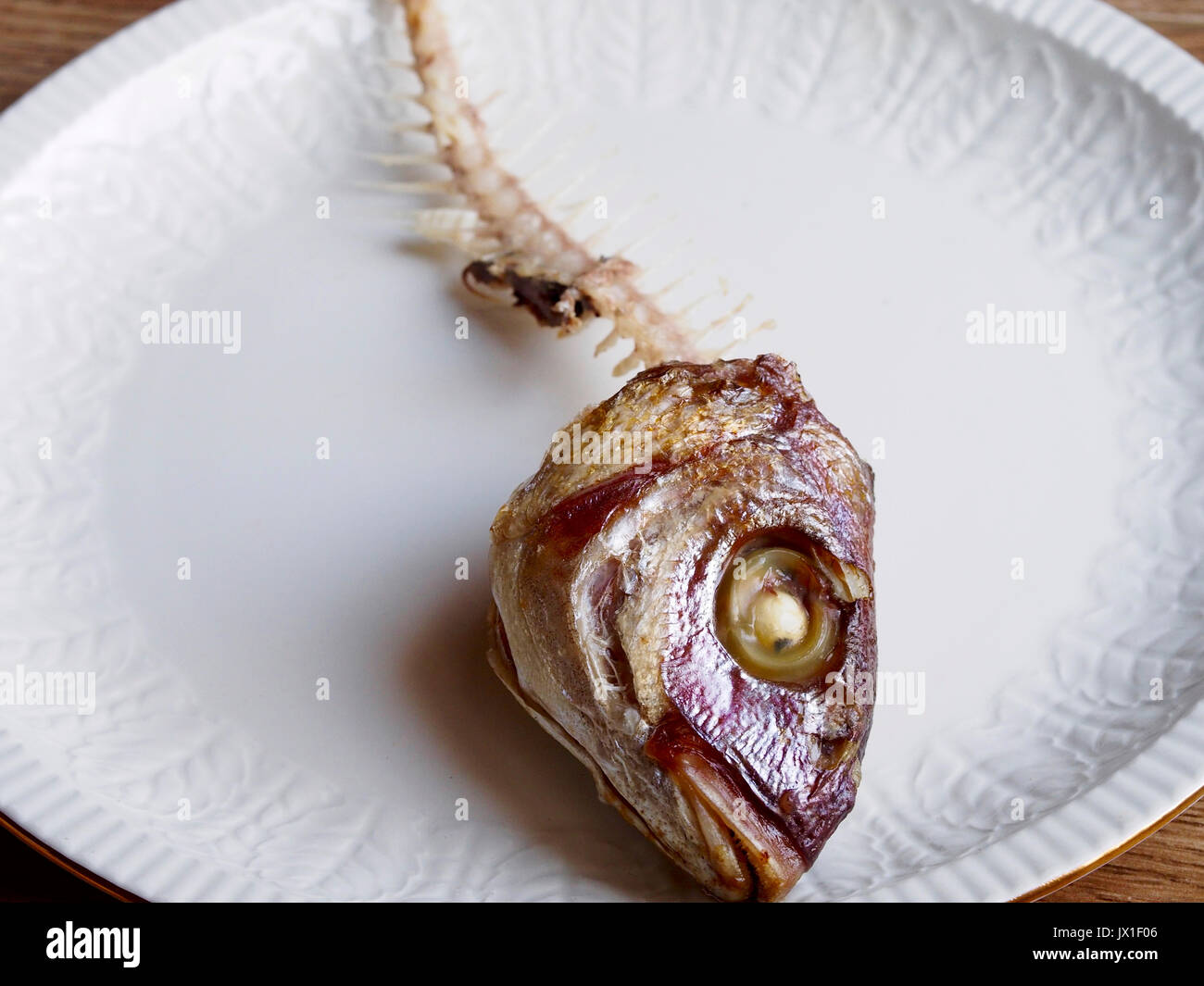 Fishbone in a beautiful plate Stock Photo - Alamy