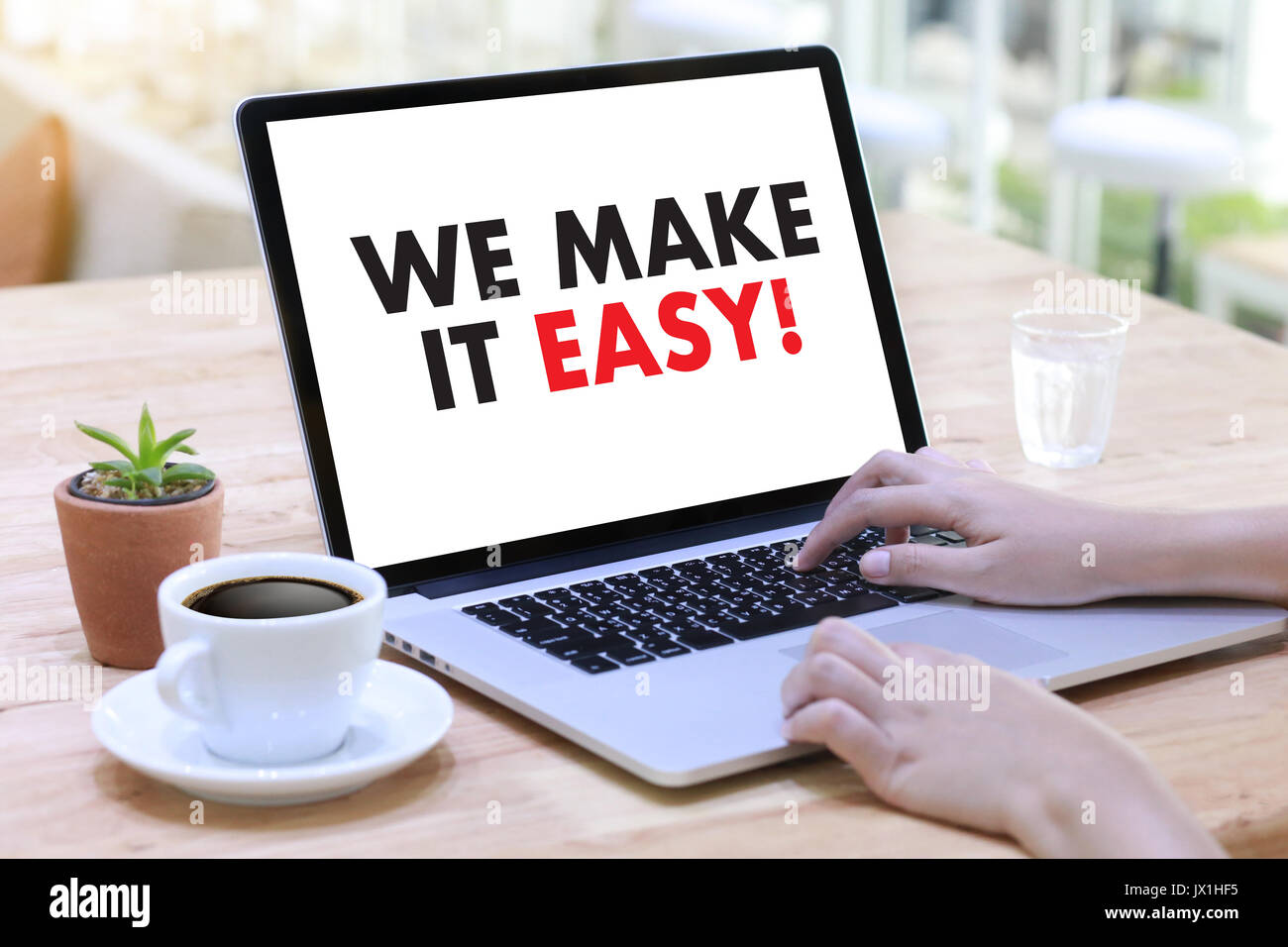 WE MAKE IT EASY! Business team hands at work with financial reports and ...