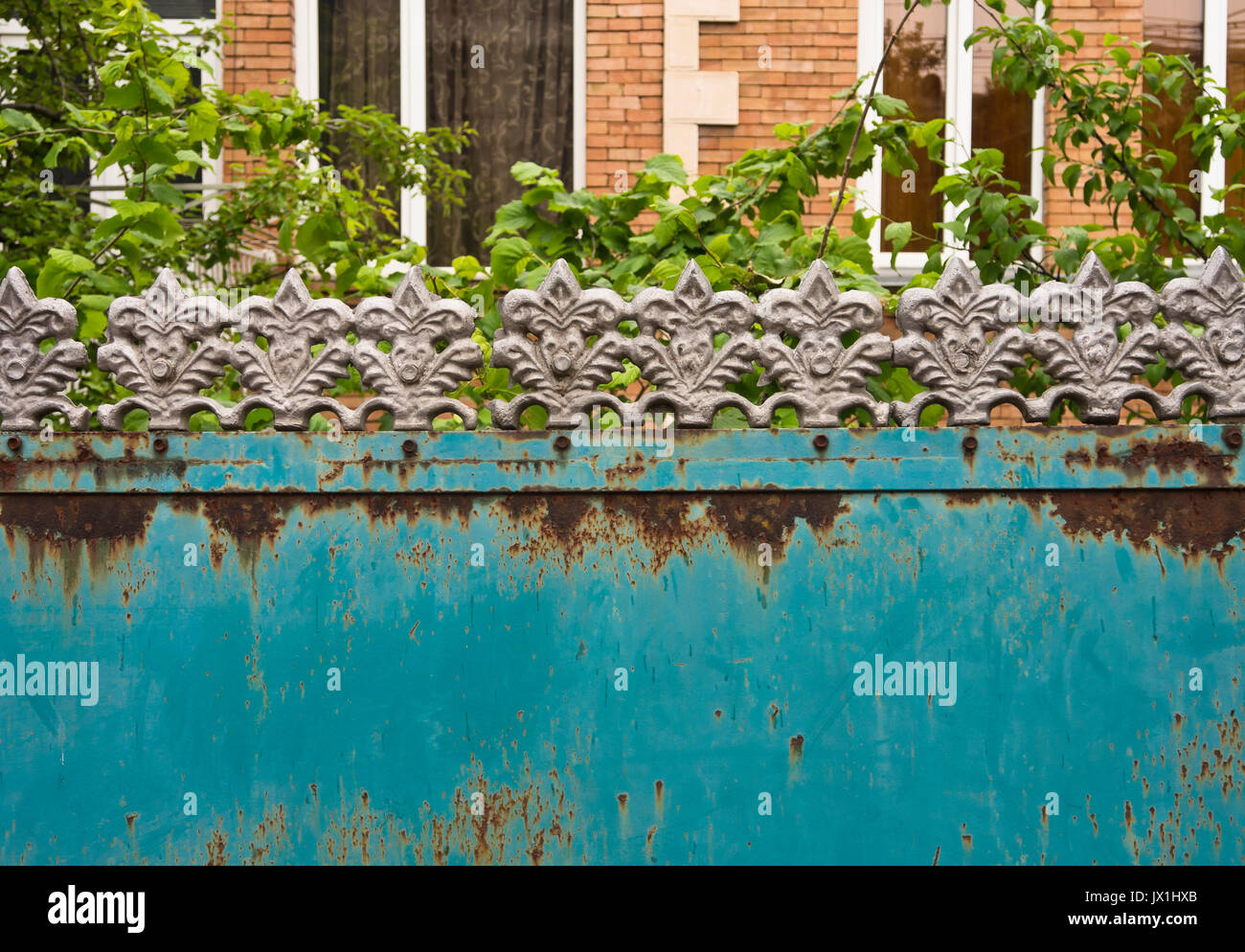 Ornamental iron gate, colourful but rusty in a suburb of Kutaisi ...