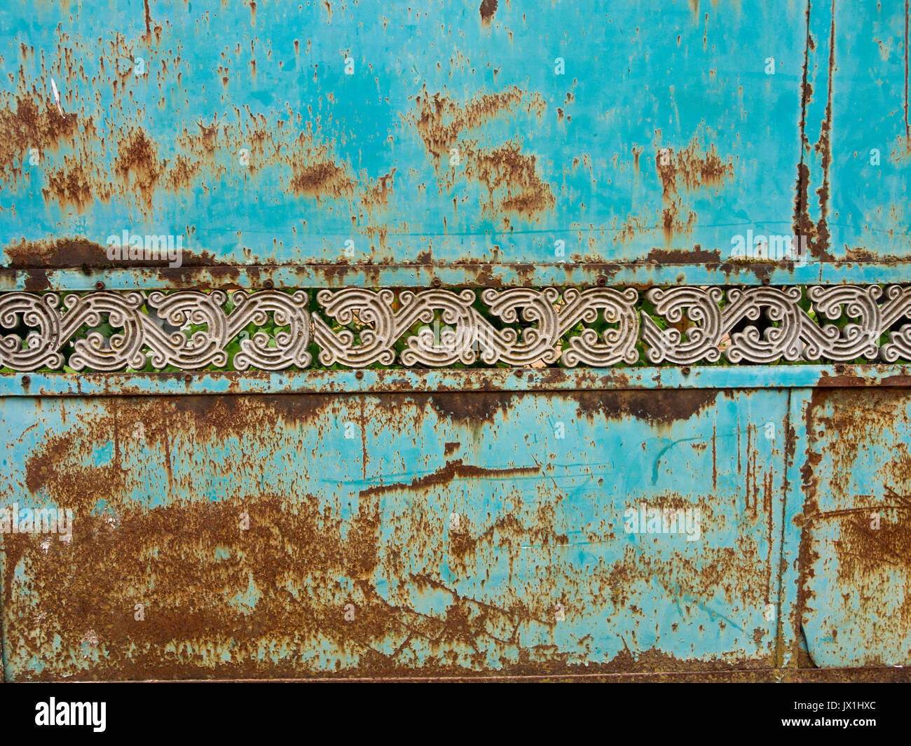 Ornamental iron gate, colourful but rusty in a suburb of Kutaisi ...