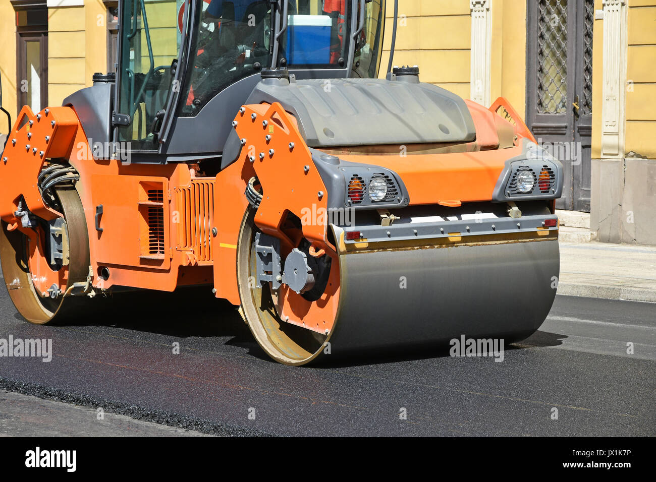 Road roller at work on the street Stock Photo - Alamy