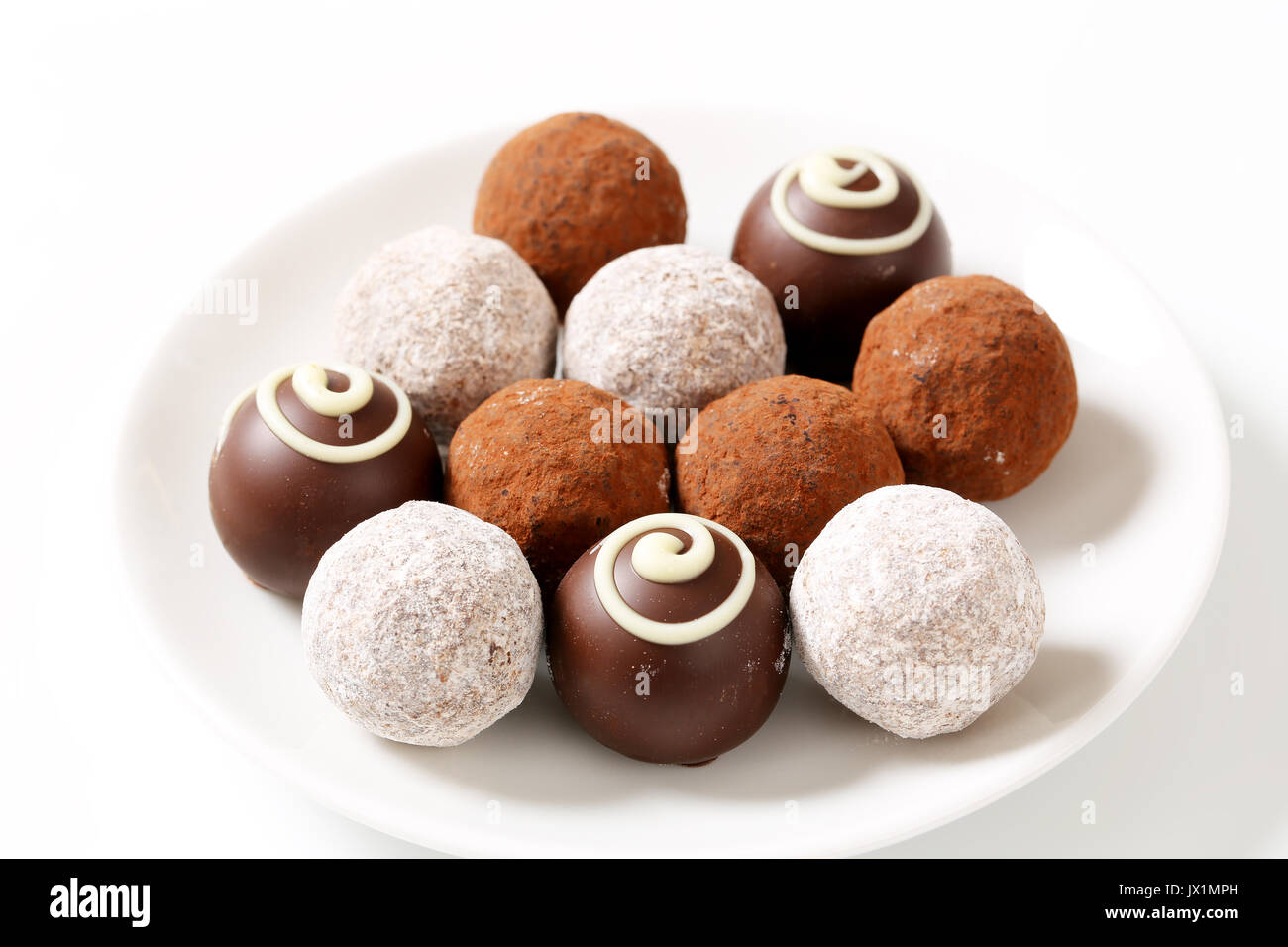 Assorted chocolate truffles and pralines with ganache filling Stock ...