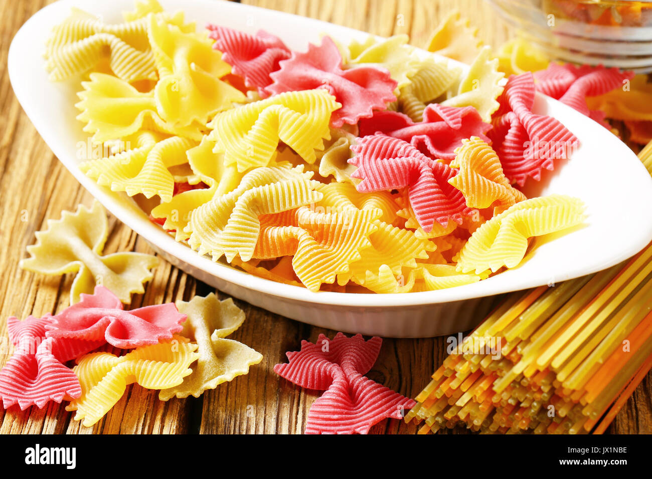 Flavored and colored bow tie pasta Stock Photo - Alamy