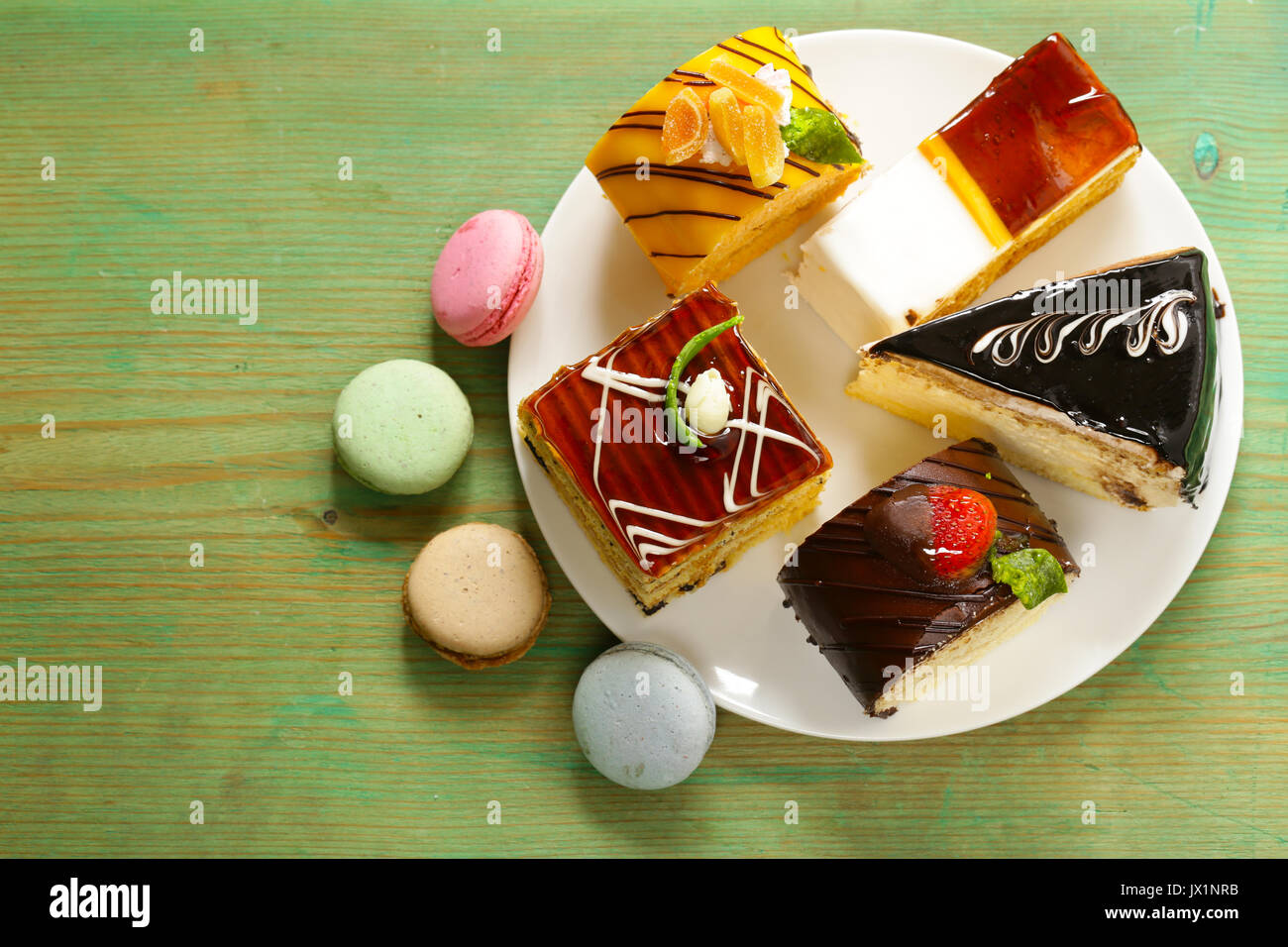 Assorted mini cakes sweet dessert, chocolate and fruit Stock Photo - Alamy