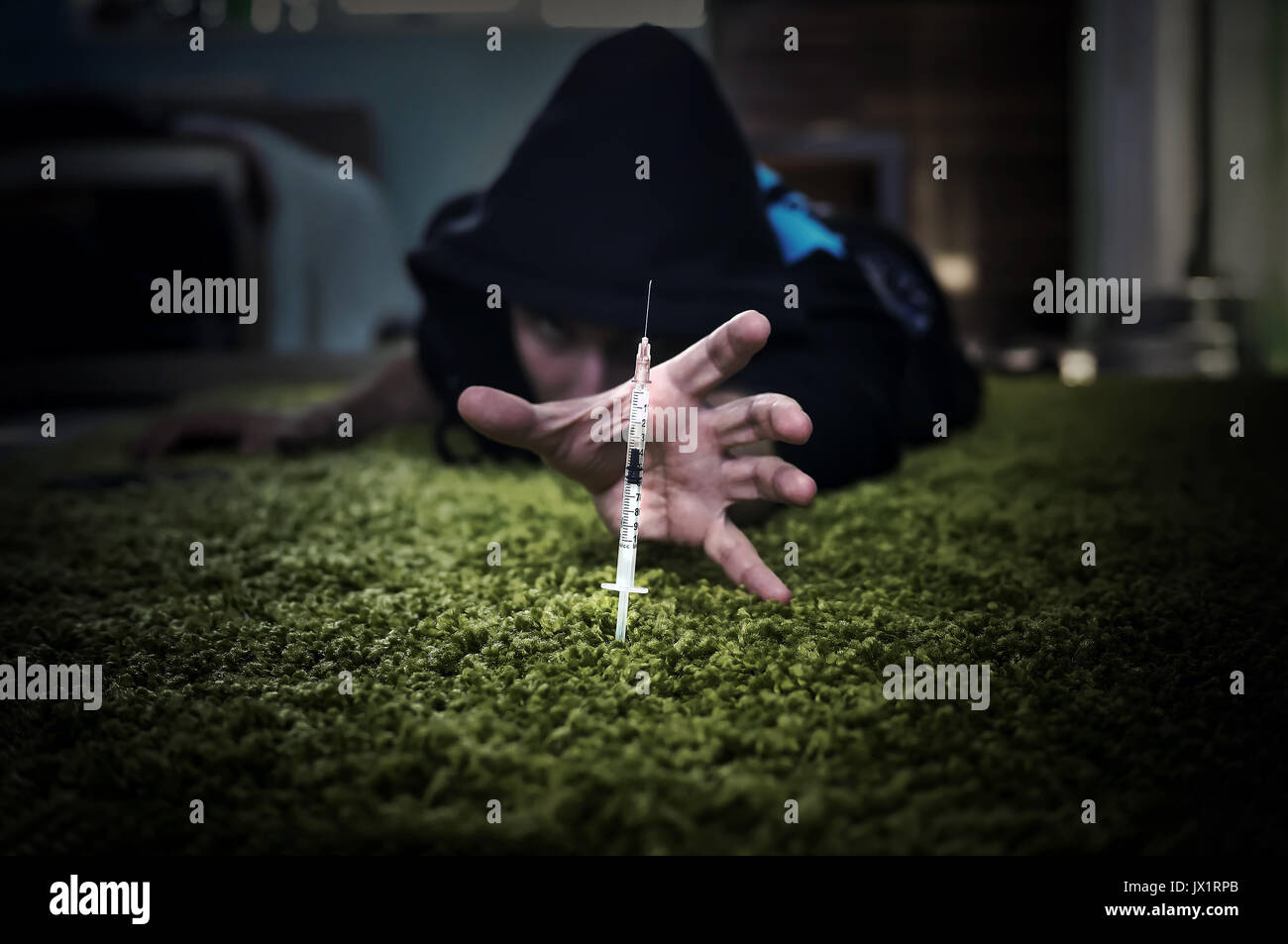 A drug addict pulls a hand to the syringe. The concept of a strong drug ...