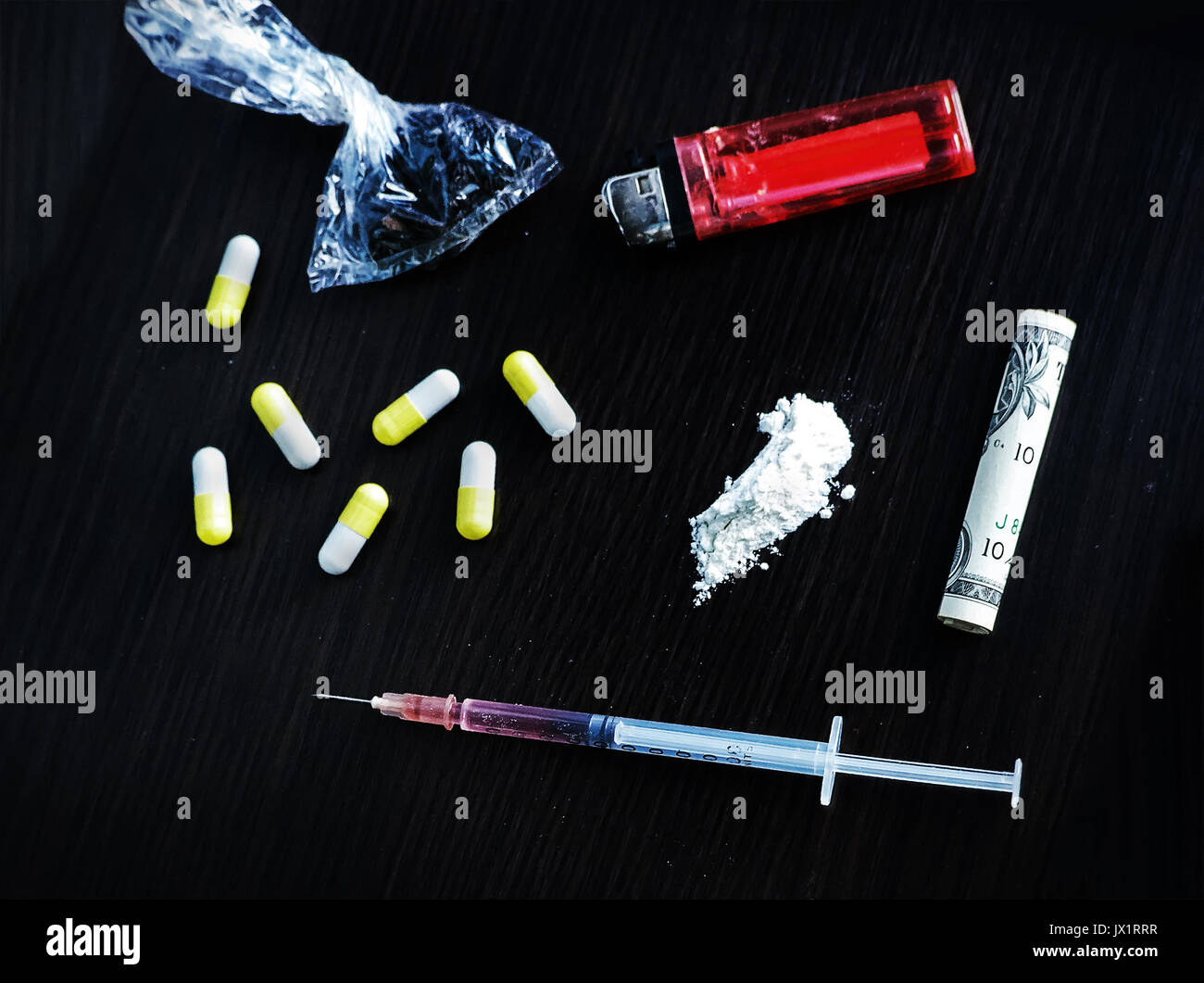 Different types of drugs are on the black table. Problems with drugs ...