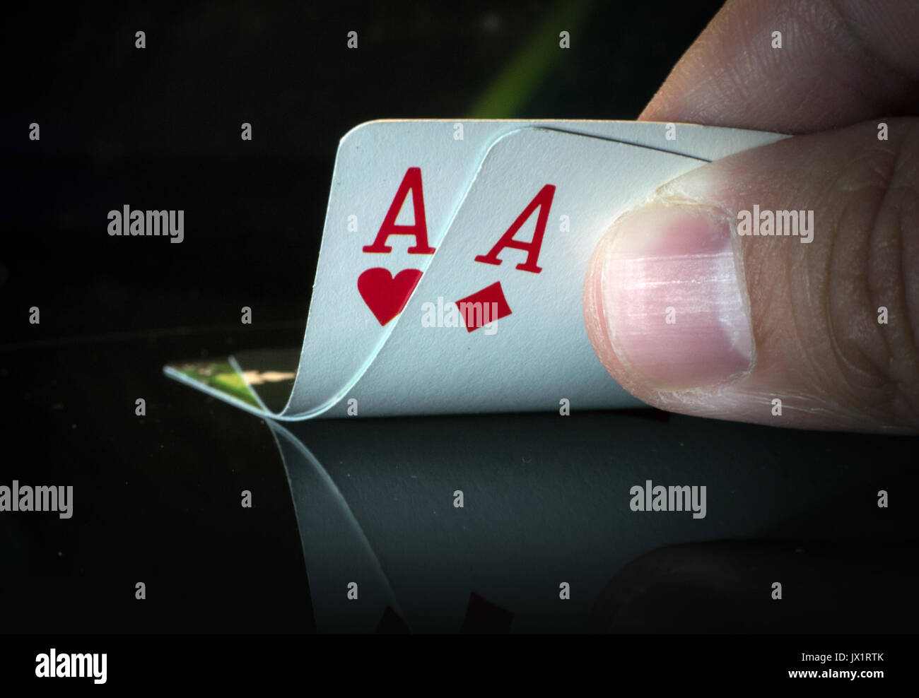 Four aces in hand cards hi-res stock photography and images - Alamy