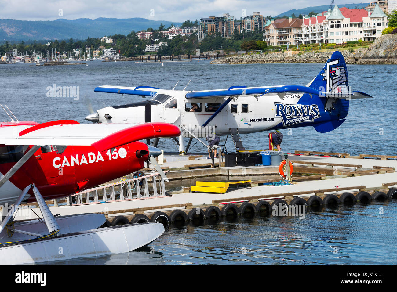 Colourful Seaplanes in the Inner Harbour Area of Victoria with Boats ...