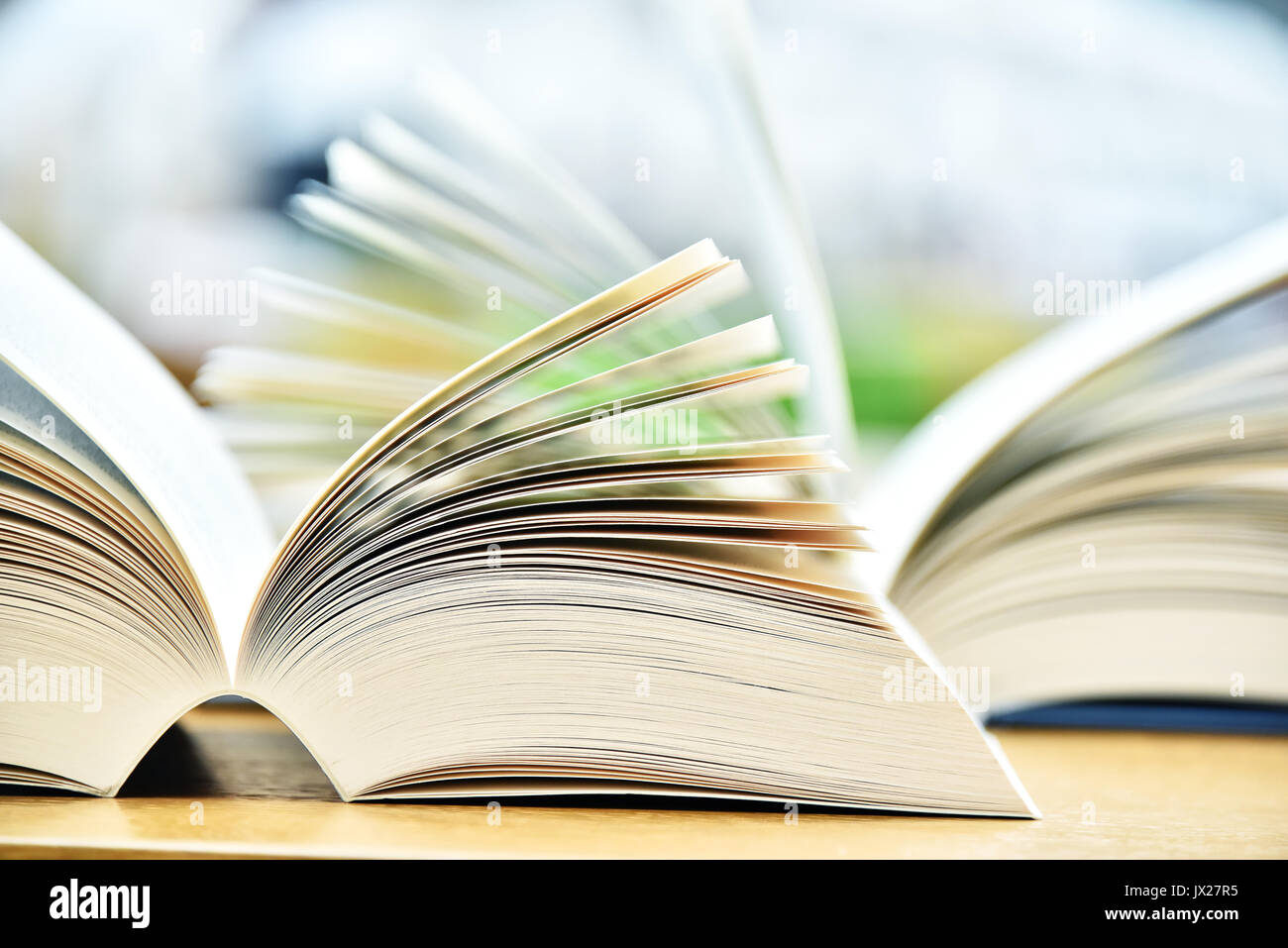 Books lying on the table in the public library Stock Photo - Alamy