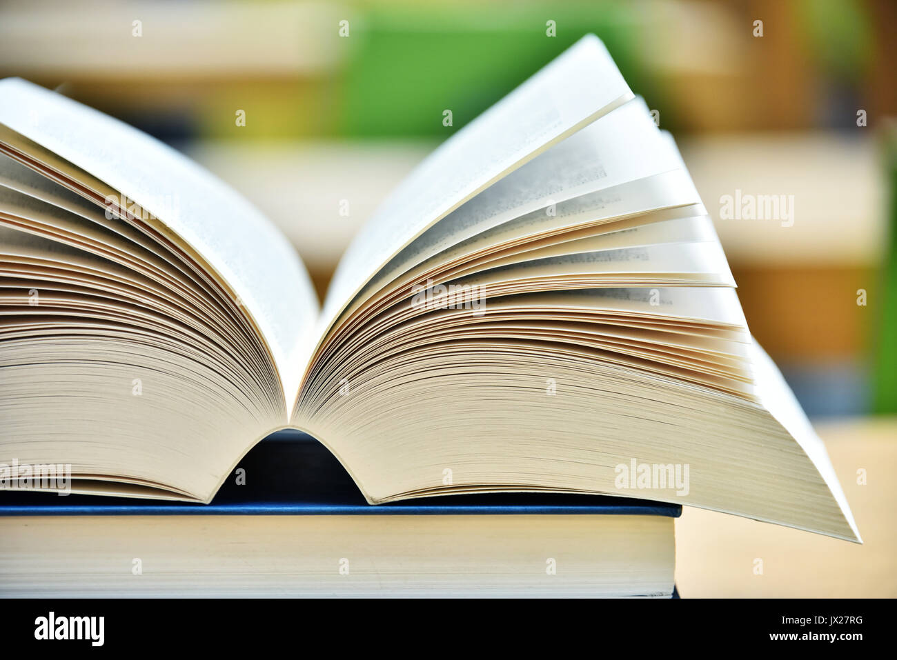 Books lying on the table in the public library Stock Photo - Alamy