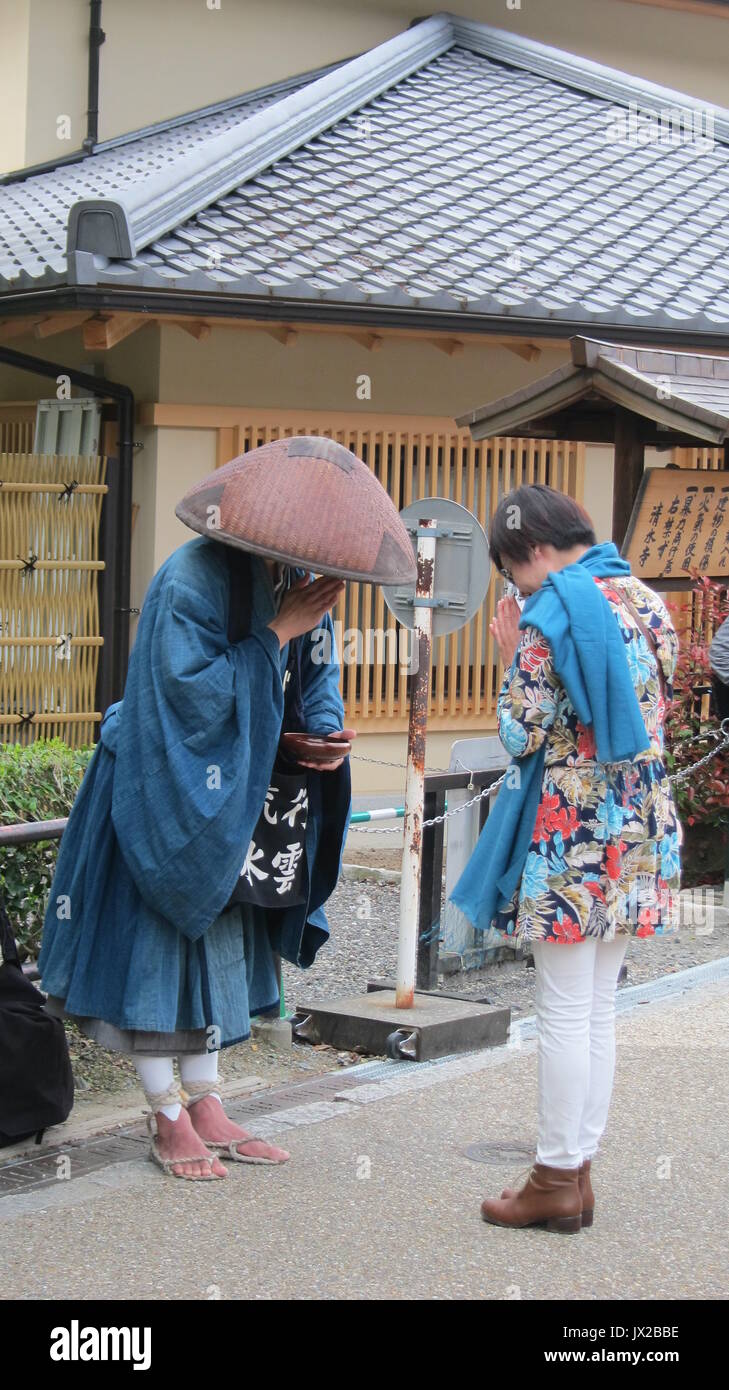 Japanese monk pray for a female visitors in Kiyomizu-dera Stock Photo ...