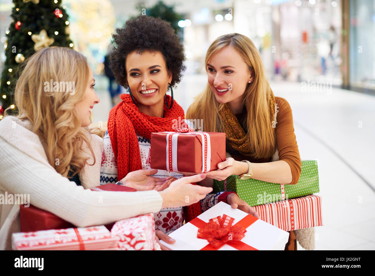 Woman receiving a gift from her friend Stock Photo - Alamy