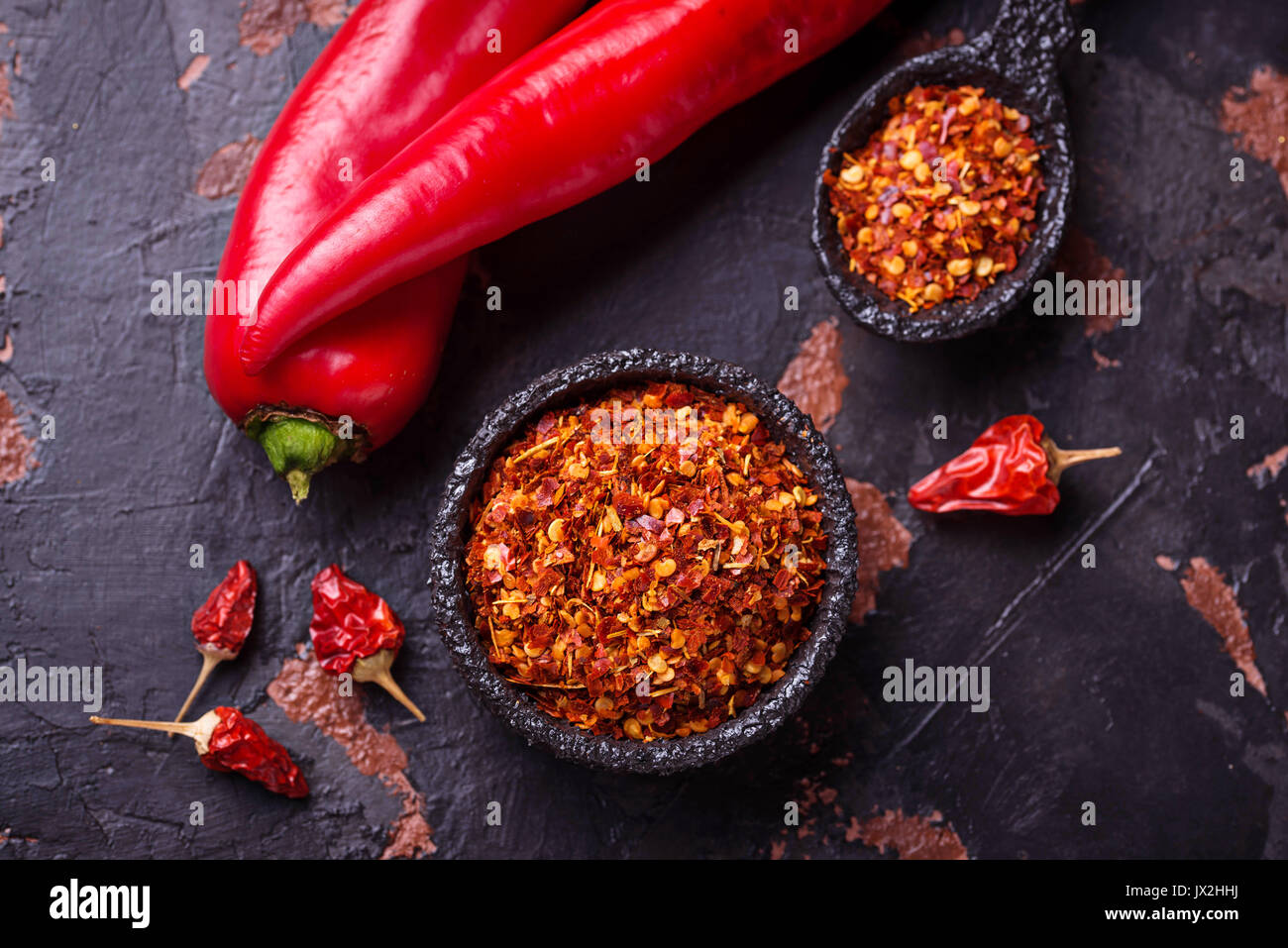 Red chili pepper on old rusty background. Top view Stock Photo - Alamy