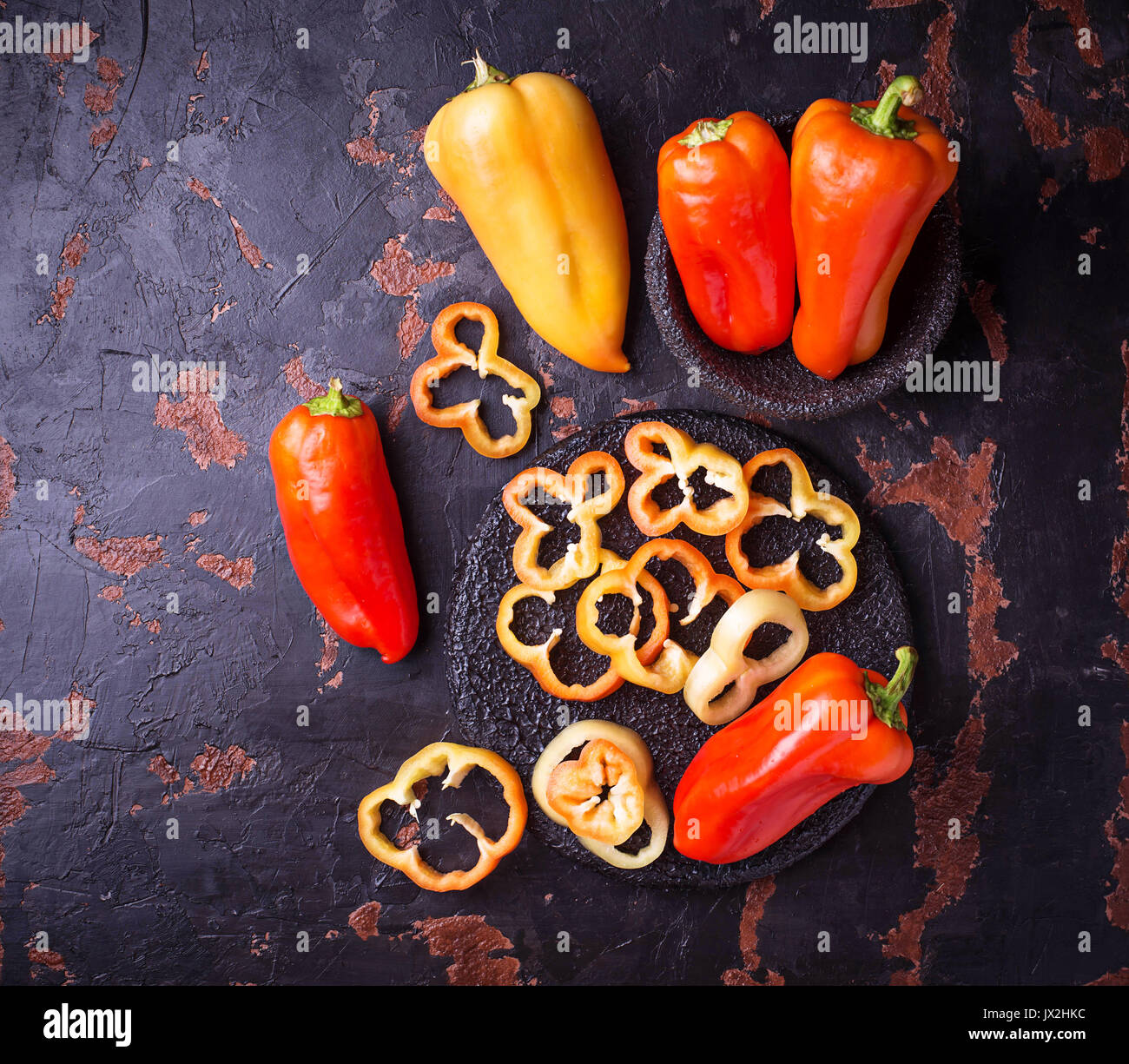 Sweet bulgarian pepper on dark rusty background. Top view Stock Photo ...