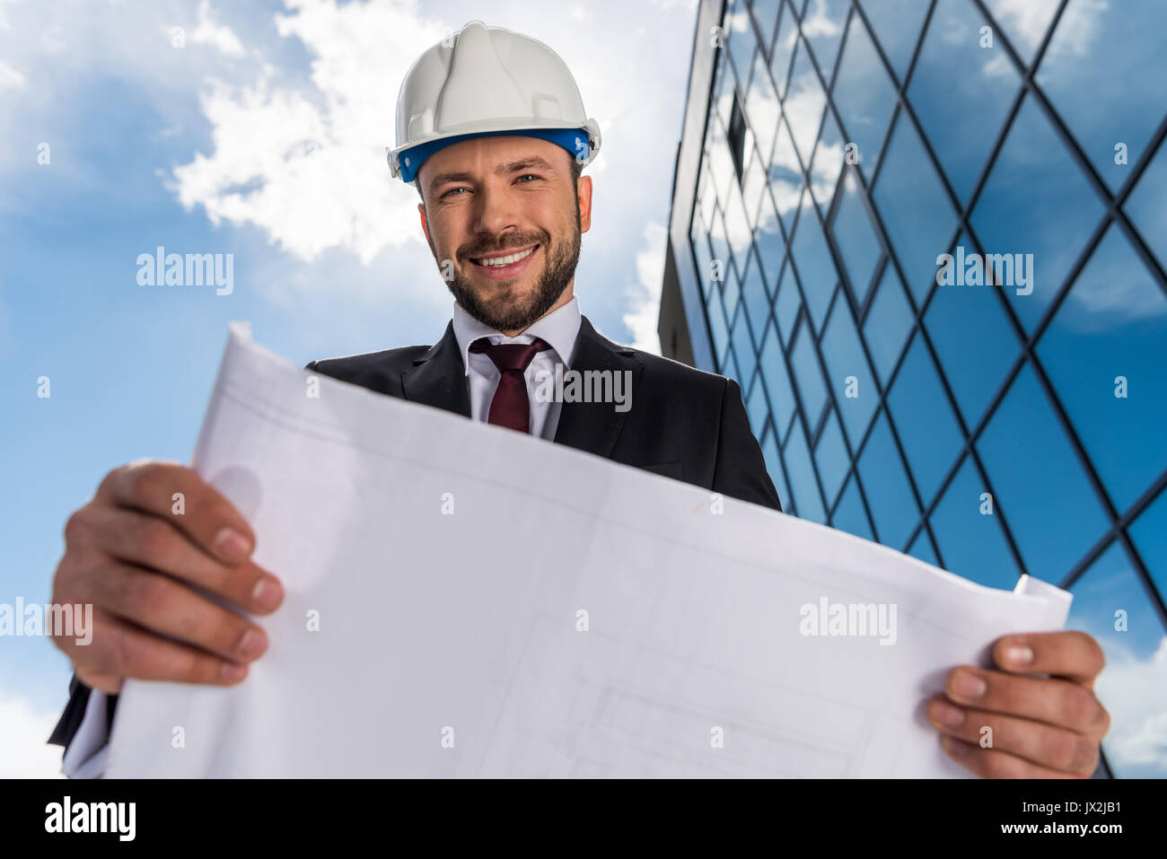 Man holding blueprint hi-res stock photography and images - Alamy