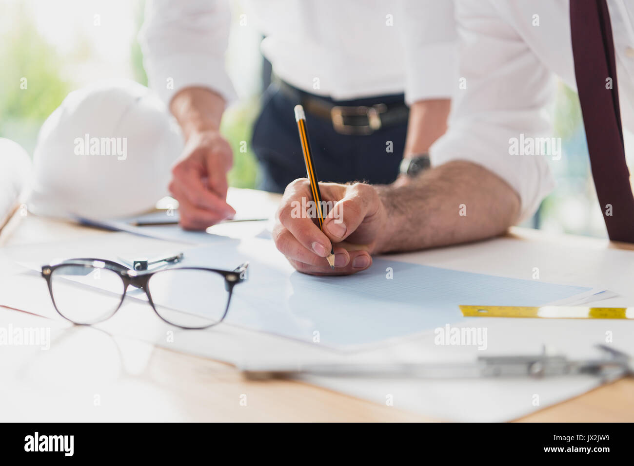 professional architects in formal wear working at modern office Stock ...