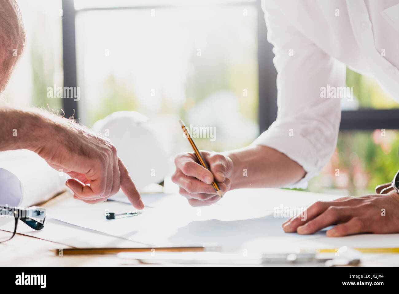 professional architects in formal wear working at modern office Stock ...