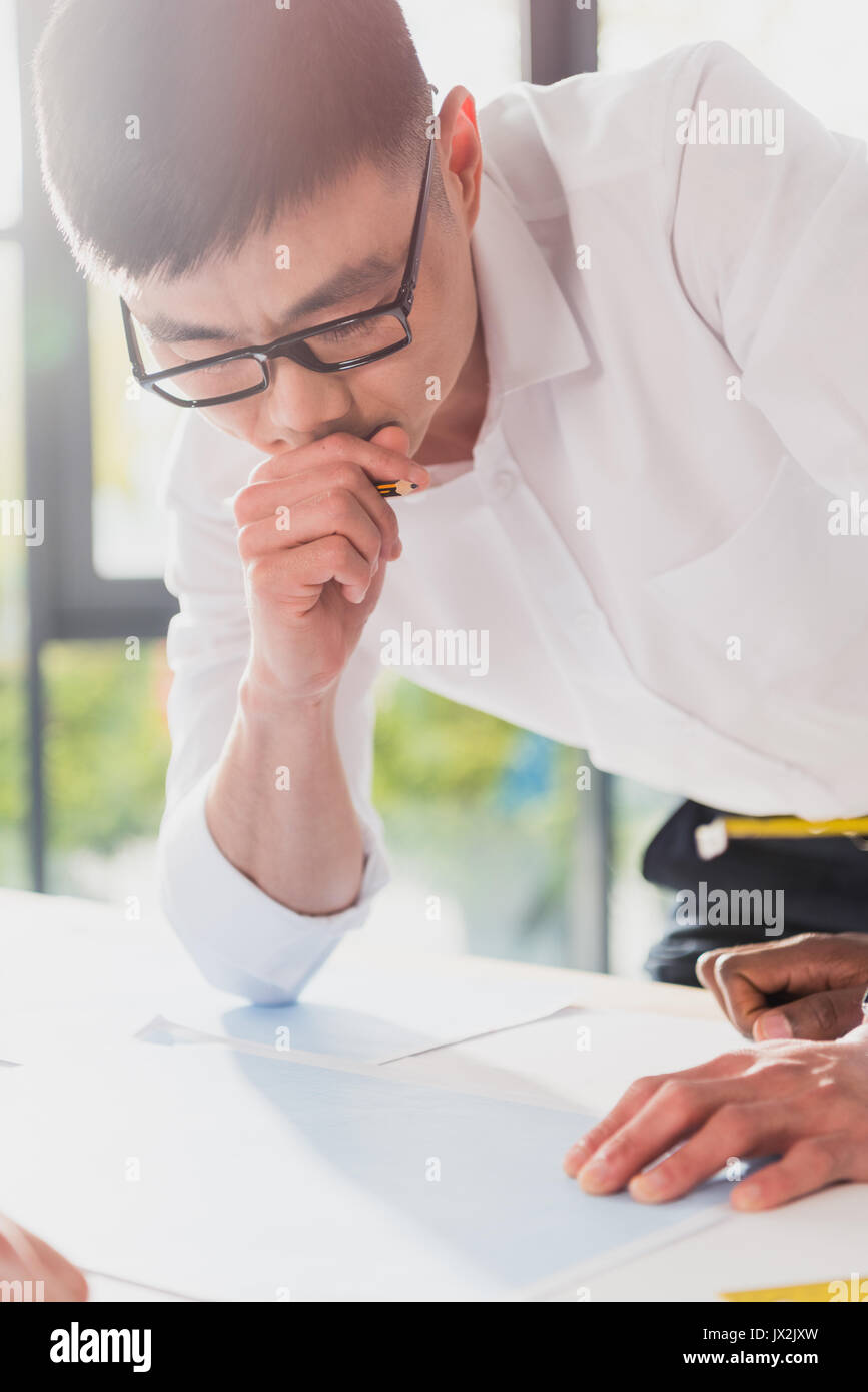 professional architect in formal wear working with blueprints at modern ... professional architect in formal wear working with blueprints at modern ...