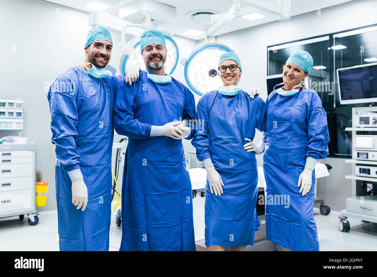 Portrait of successful medical workers in surgical uniform in operation ...